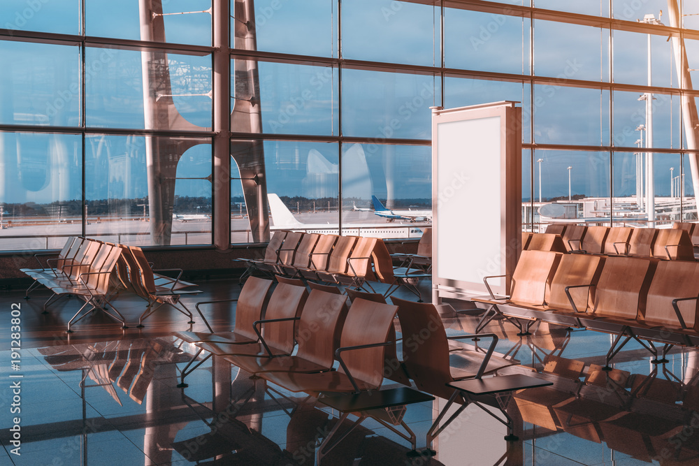 Empty white advertising banner template indoors of departure hall of ...