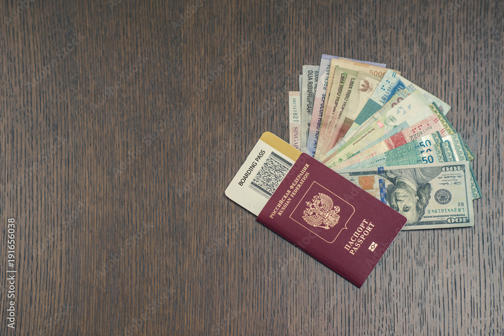 Foreign passport with boarding pass. Money of south-east Asia and ...