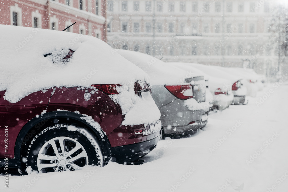 Parked cars stuck in snow after heavy snowstorm stand at parking lot ...