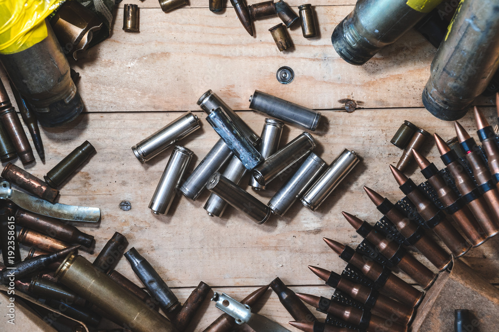 Foto de Stock Heap of old batteries in wooden box with bullets, concept ...