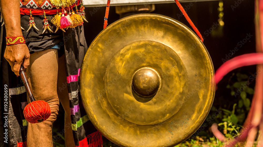 Dayak (native tribe of Borneo) man ready to hit the Gong on traditional ...