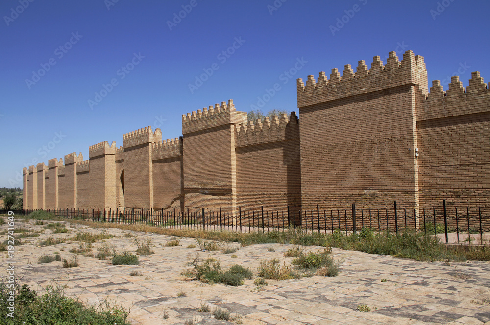 Restored ruins of ancient Babylon, Iraq. In front of the wall is ...