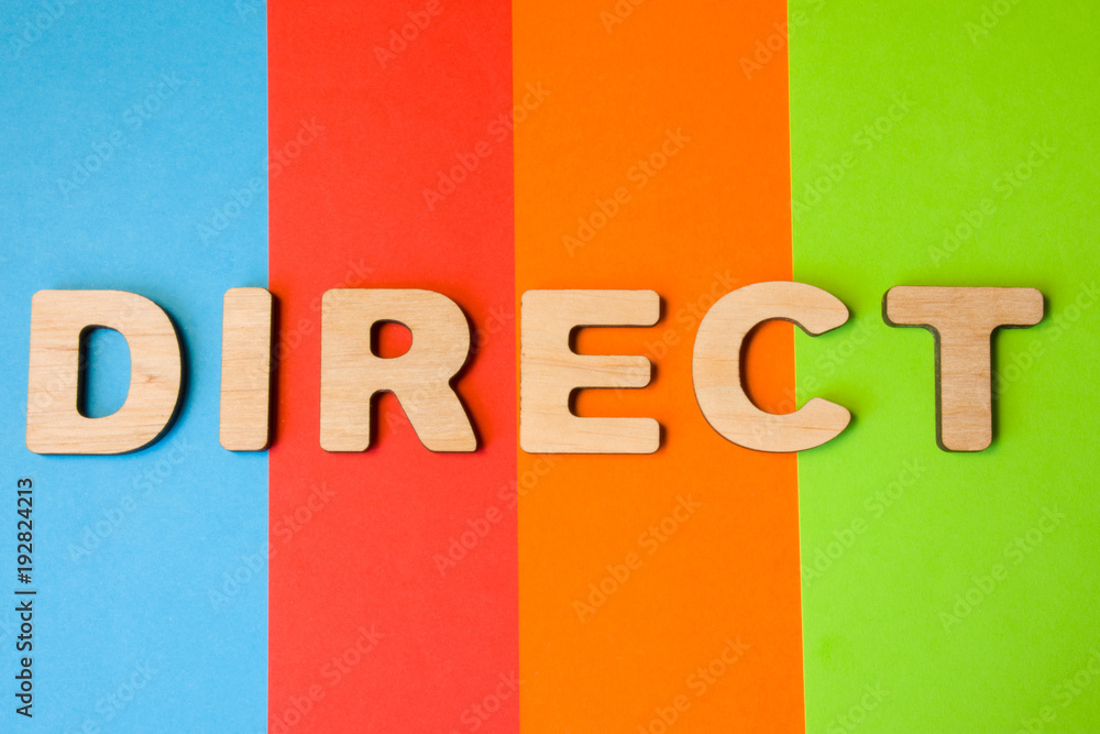 Word Direct of large wooden letters on colored background of 4 colors ...
