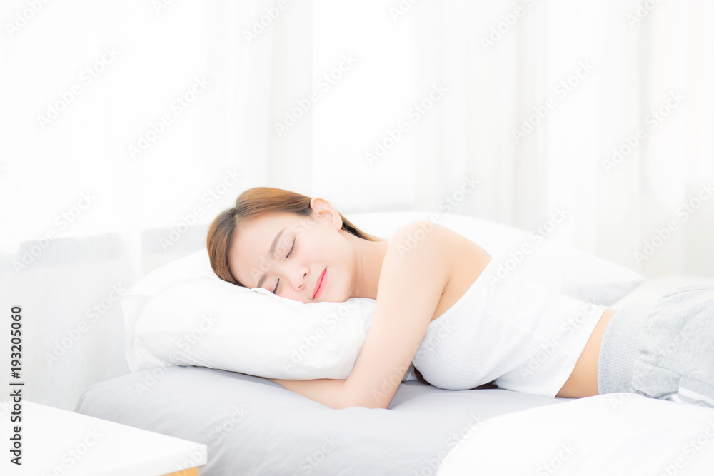 Beautiful asian young woman sleeping lying in bed with head on pillow comfortable and happy ...