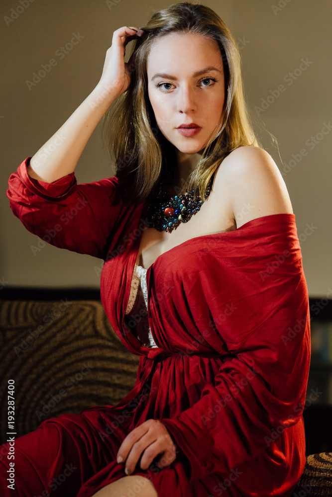 Beautiful sexy lady in elegant red robe. Fashion portrait of model ...