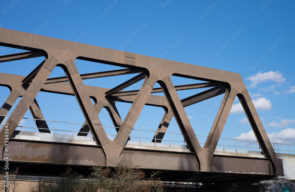Truss railway bridge with riveted construction against blue sky Stock ...