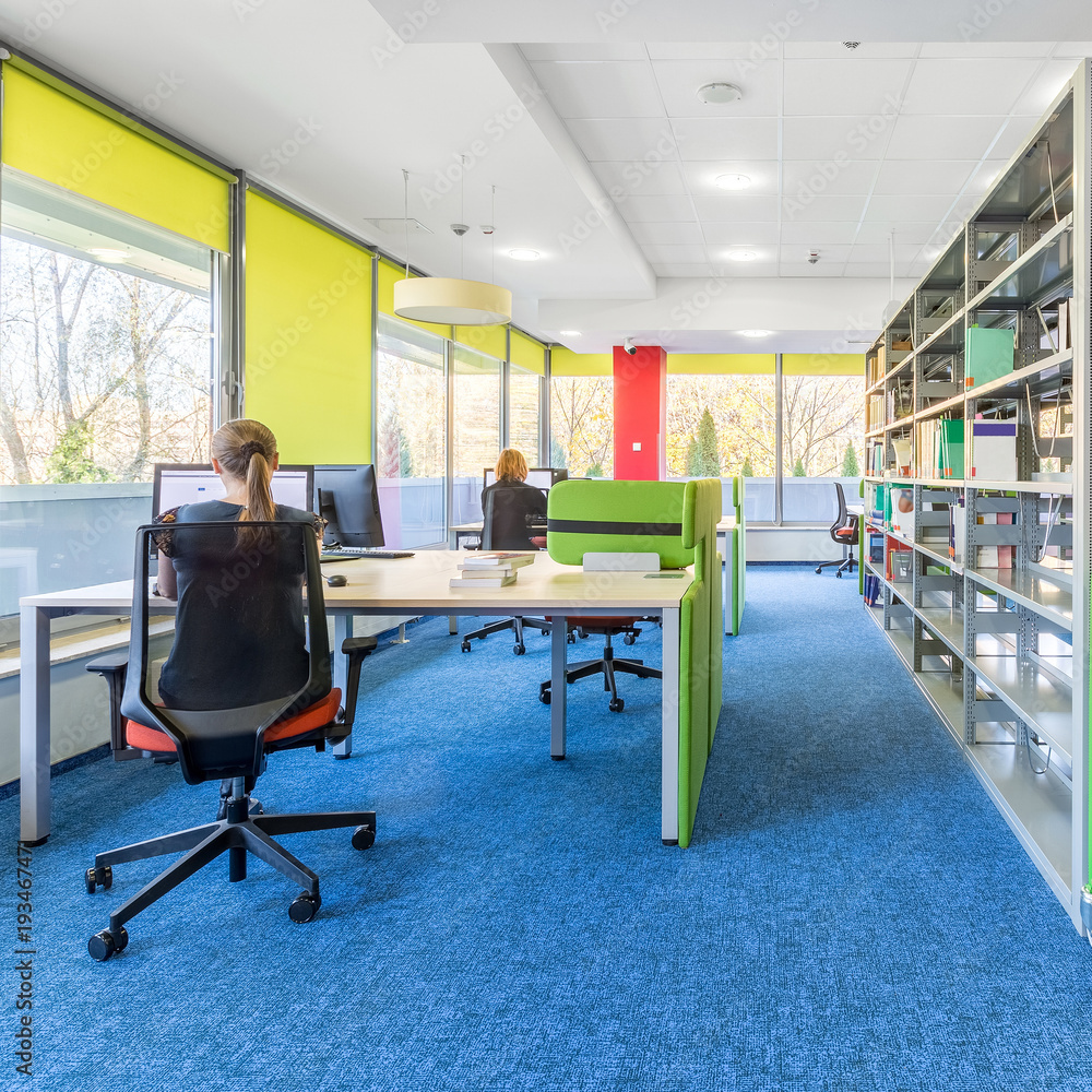 Library with computer workstation Stock Photo | Adobe Stock