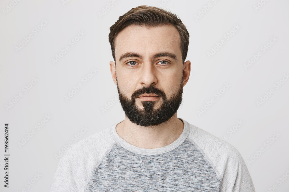 Calm interesting bearded guy in trendy shirt with normal face ...