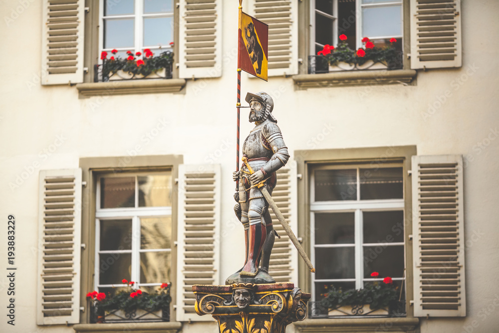 Streets of Bern with a statue and a flag Stock Photo | Adobe Stock