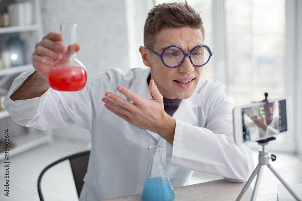 Interesting experiment. Handsome determined fair-haired teenager ...