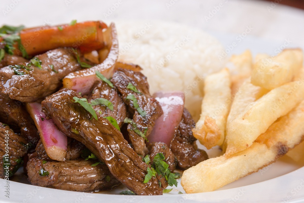Peruvian food: lomo saltado. Stock Photo | Adobe Stock