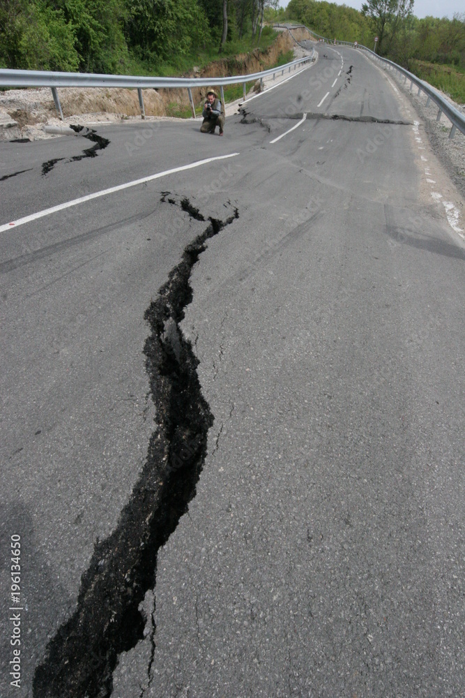 Road collapses with huge cracks. International road collapsed down ...