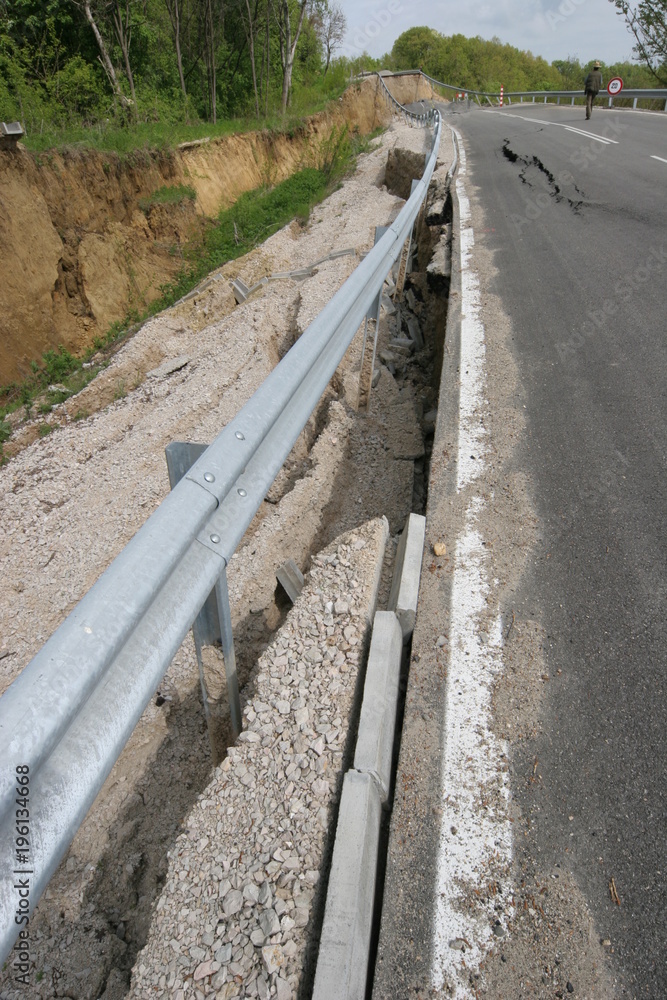Road collapses with huge cracks. International road collapsed down ...