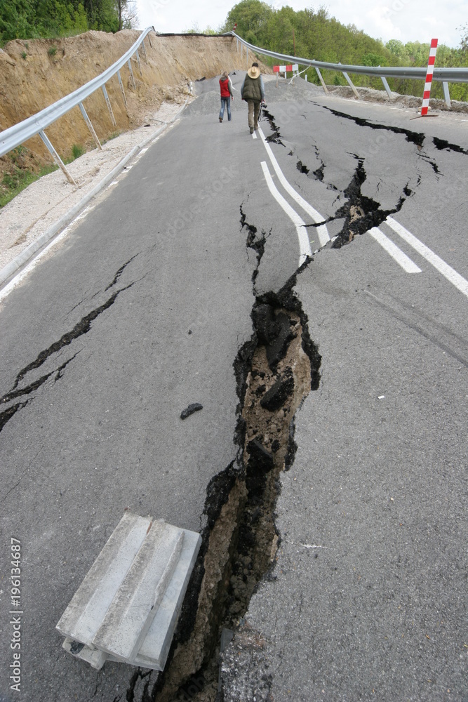 Road collapses with huge cracks. International road collapsed down ...