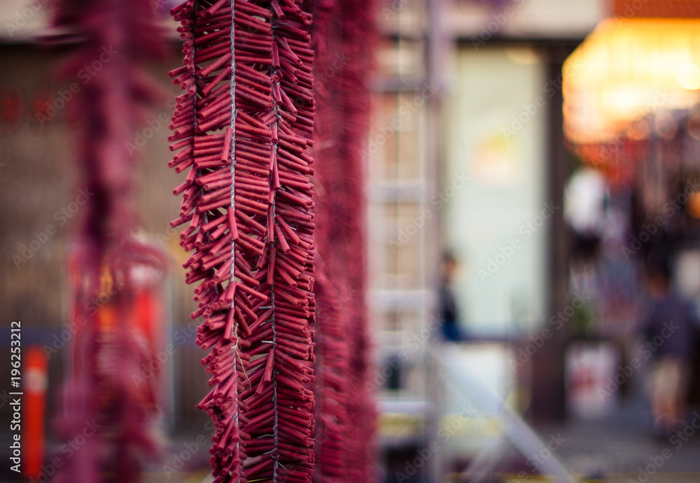 Firecrackers hanging on strand with blurred background Stock Photo ...