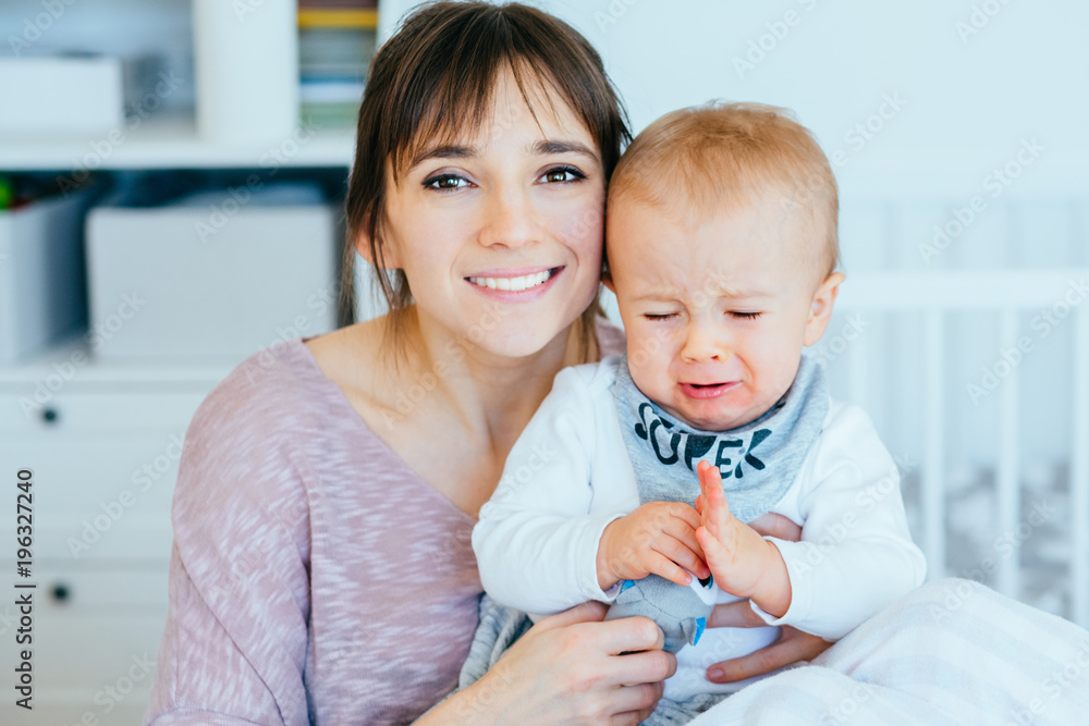 Foto de Stock Mother and baby boy family portrait, smiling woman ...