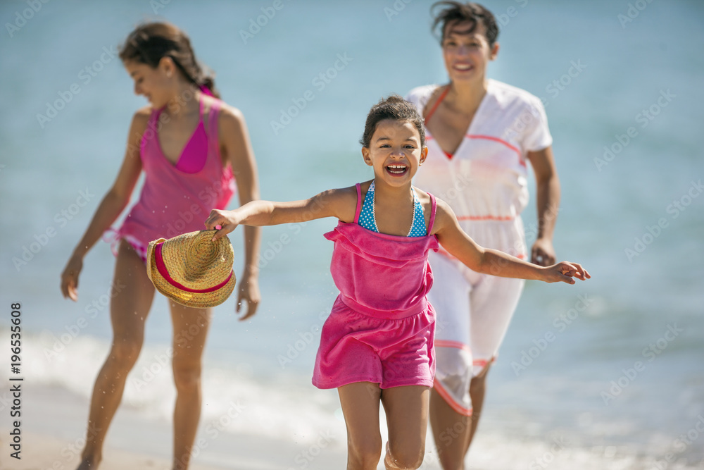 Family enjoying at the beach Stock Photo | Adobe Stock