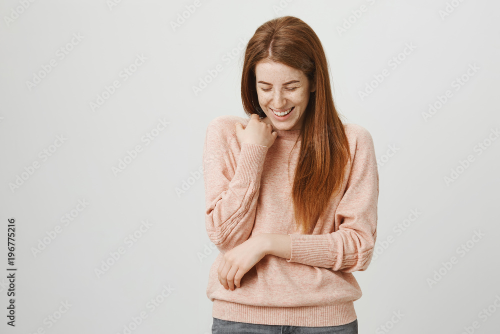 Studio portrait of happy adult redhead female model laughing out loud ...