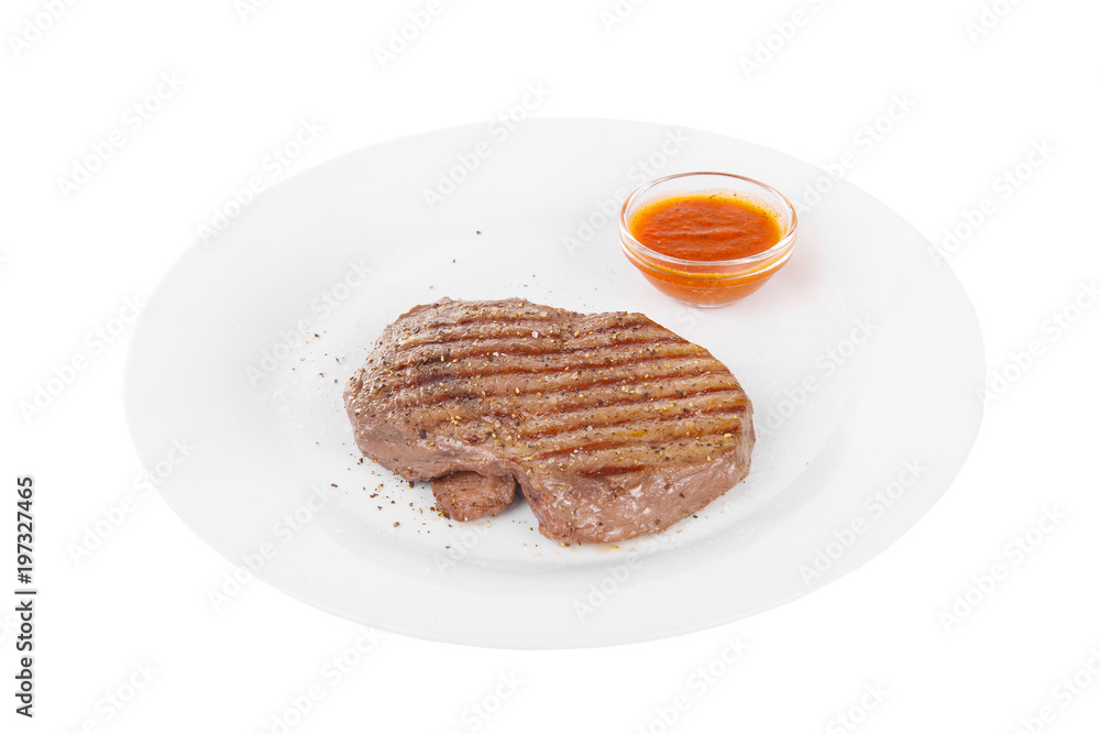 Steak beef, pork, lamb, grilled meat, barbecue, on a plate isolated white background. Tomato ...