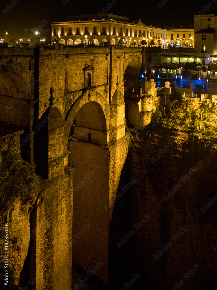 Medieval bridge in night. Ronda, Spain. Famous bridge also known as ...