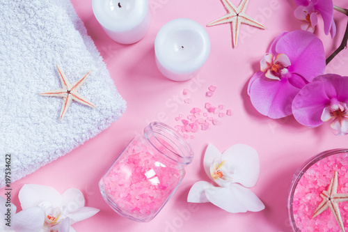 Spa background, flat lay layout with pink sea salt, candles and aroma ...