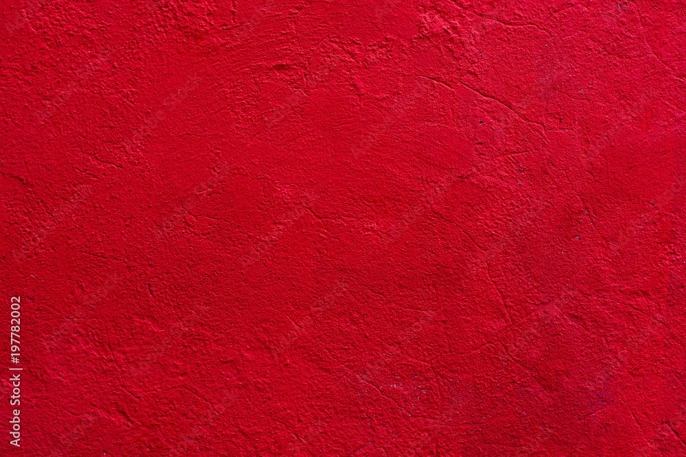 Background of a red stucco coated and painted exterior, rough cast of ...