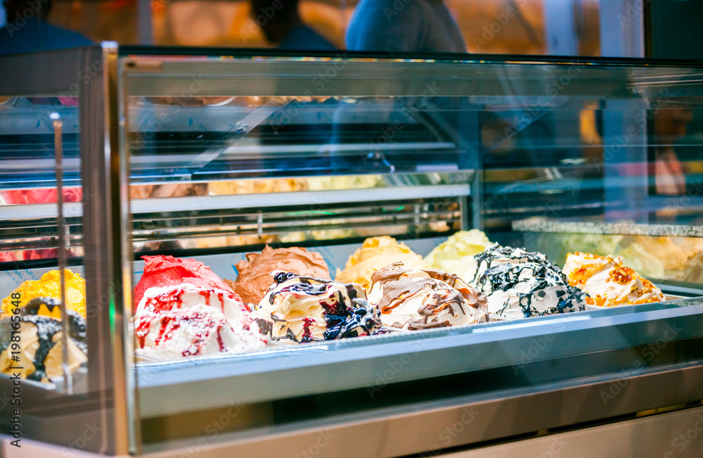 Showcase fridge in pastry shop, different types of ice cream Stock ...