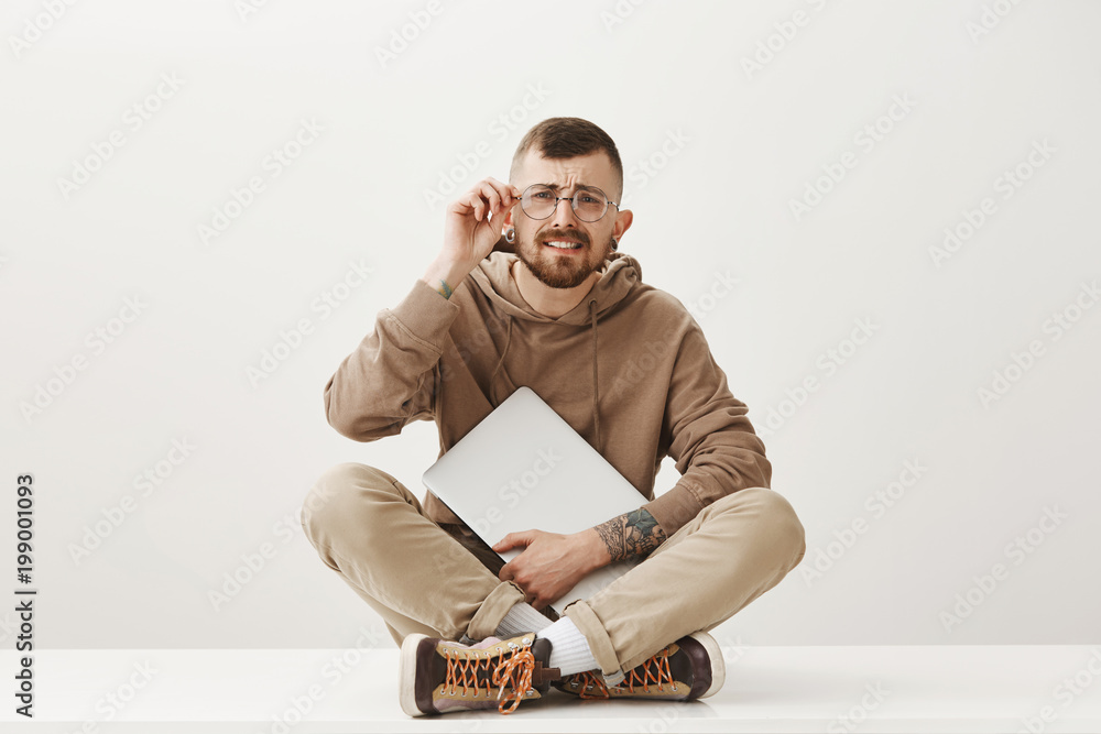 repeat what you just said. Portrait of displeased nerdy attractive guy ...