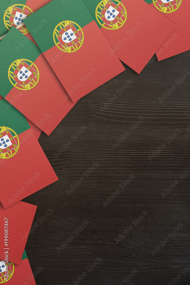 Portugal small flags framing a wood texture background with copy space ...