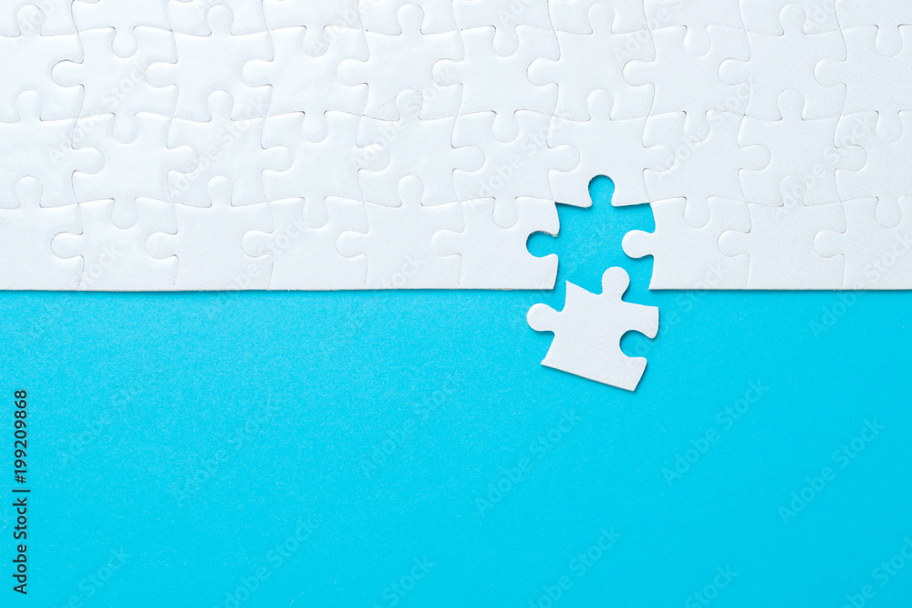 Blue background made from white puzzle pieces and place for your ...