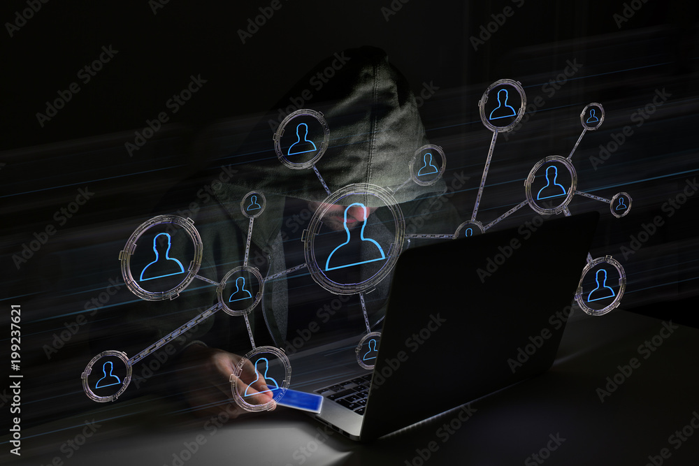 Photo Stock Hacker man in the dark using computer to hack data and ...