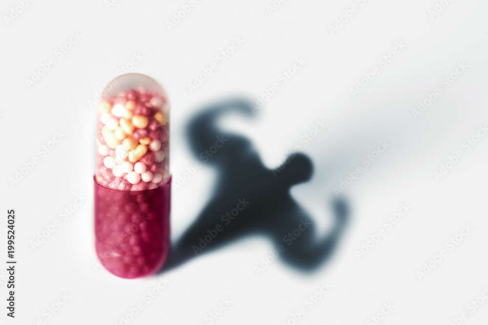 Sports doping, anabolic capsule - shape of a male muscular upper body ...