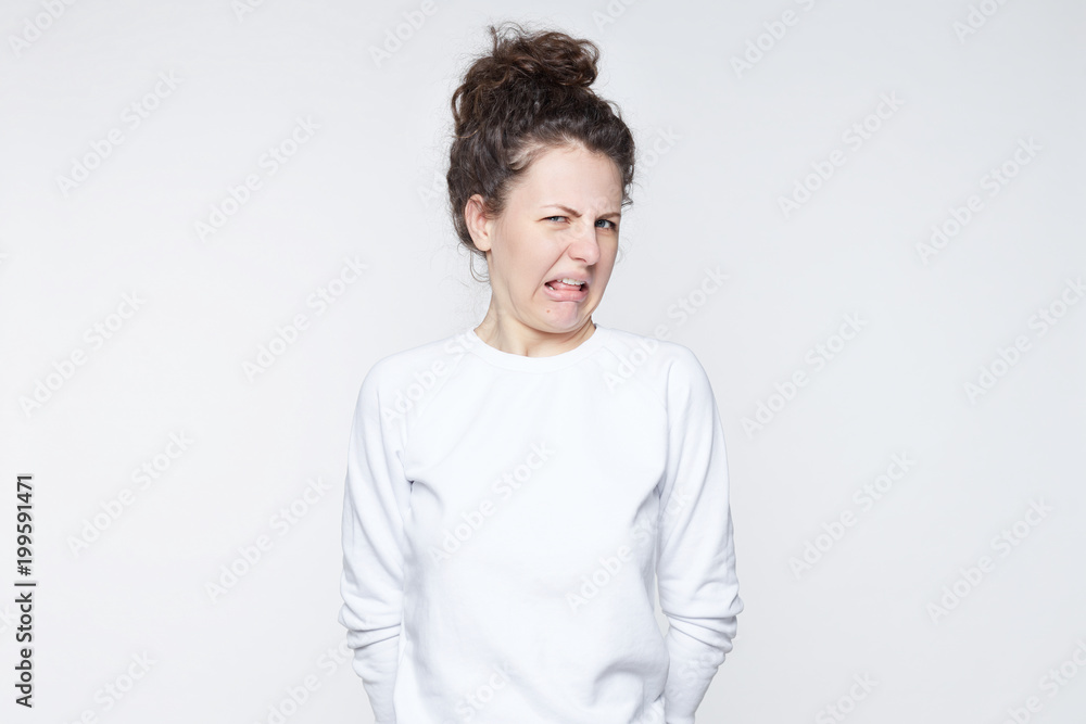 Ew. It's so gross. Young woman with disgusted expression repulsing ...
