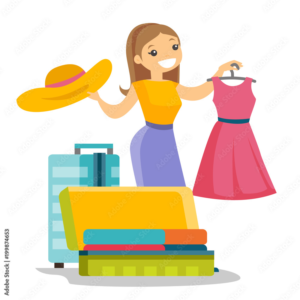 Young caucasian white woman packing her clothes in an opened suitcase ...
