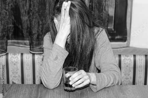 Drunk woman with smoking cigarette and glass of alcohol drink sitting ...