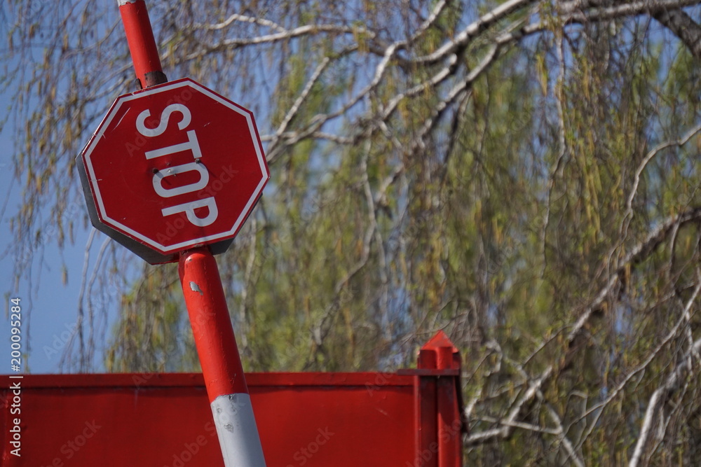 "Stop"sign and tree Stock Photo | Adobe Stock