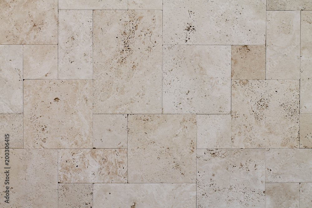 Natural Italian stone. Smooth travertine surface. A sample of wall ...