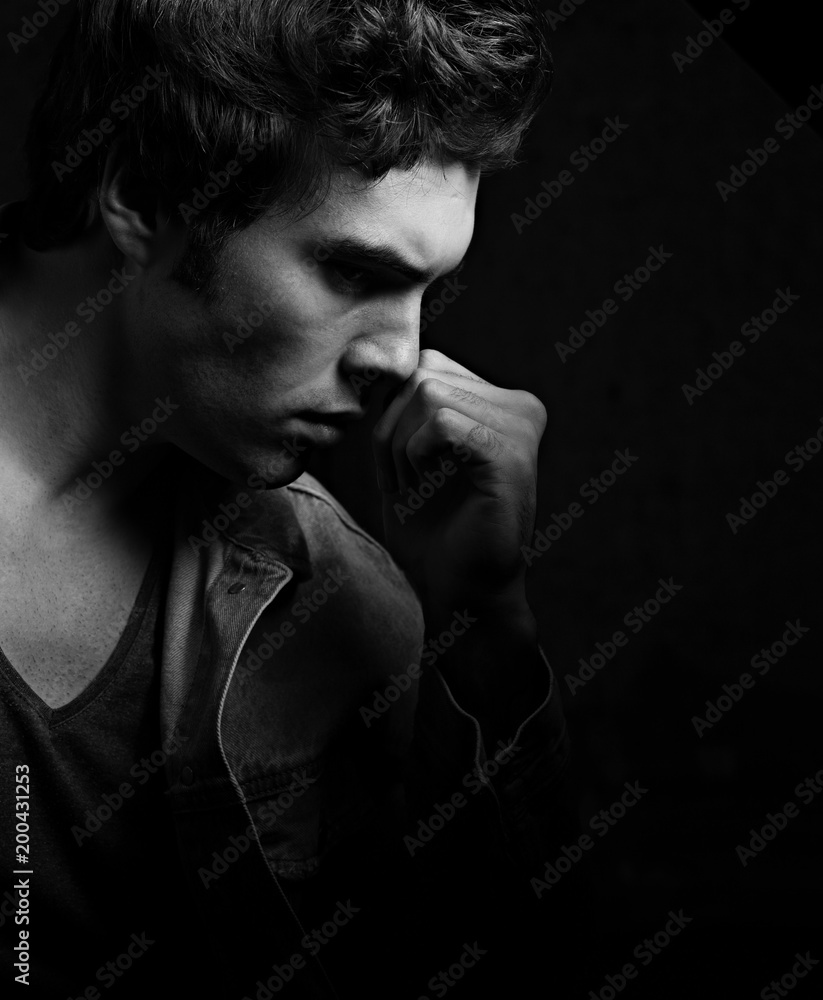 Thinking serious depression charismatic man looking down on dark shadow ...