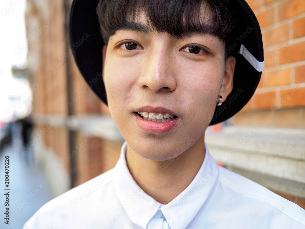 Portrait of a Chinese young man smiling with braces on teeth. Stock ...