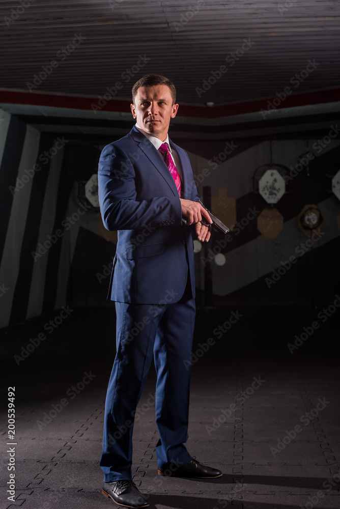 Photo Stock A middle-aged man in a business suit and tie looks like a ...