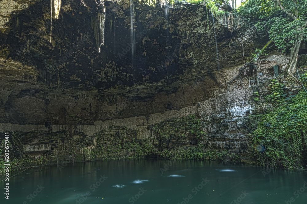 Cenote is a natural sinkhole, resulting from the collapse of limestone ...