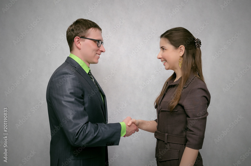 Businessman and businesswoman gives a handshake to each other isolated ...