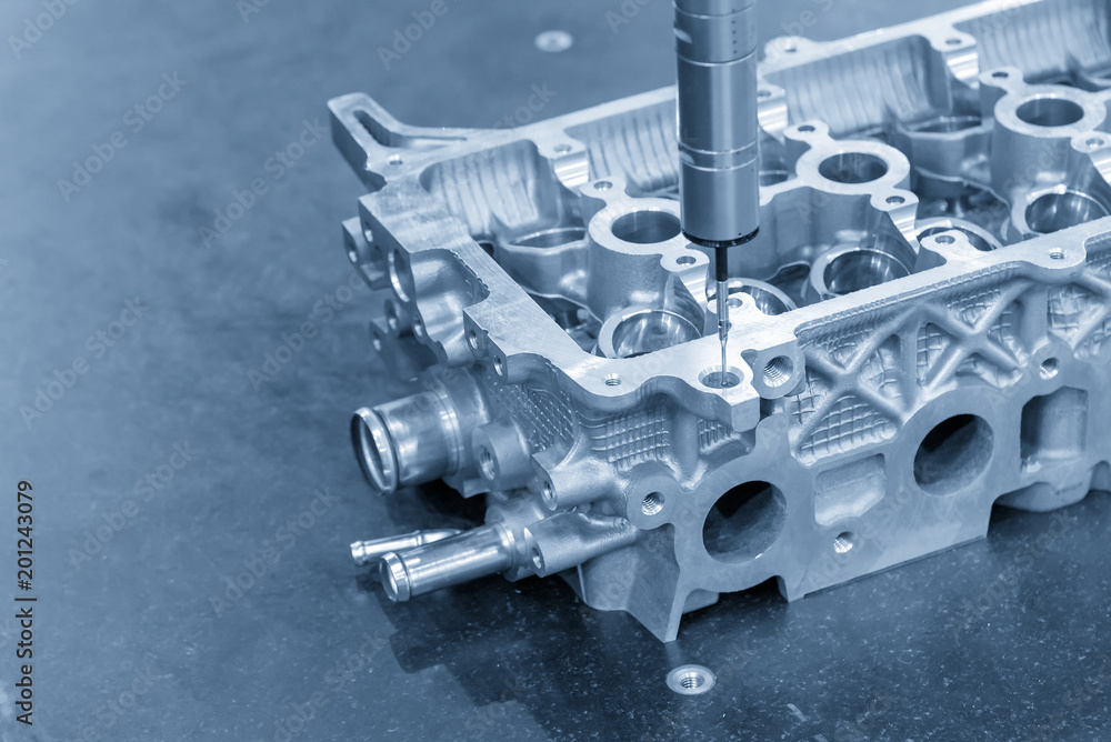 The multi-axis CMM machine measure the aluminum automotive part .The ...