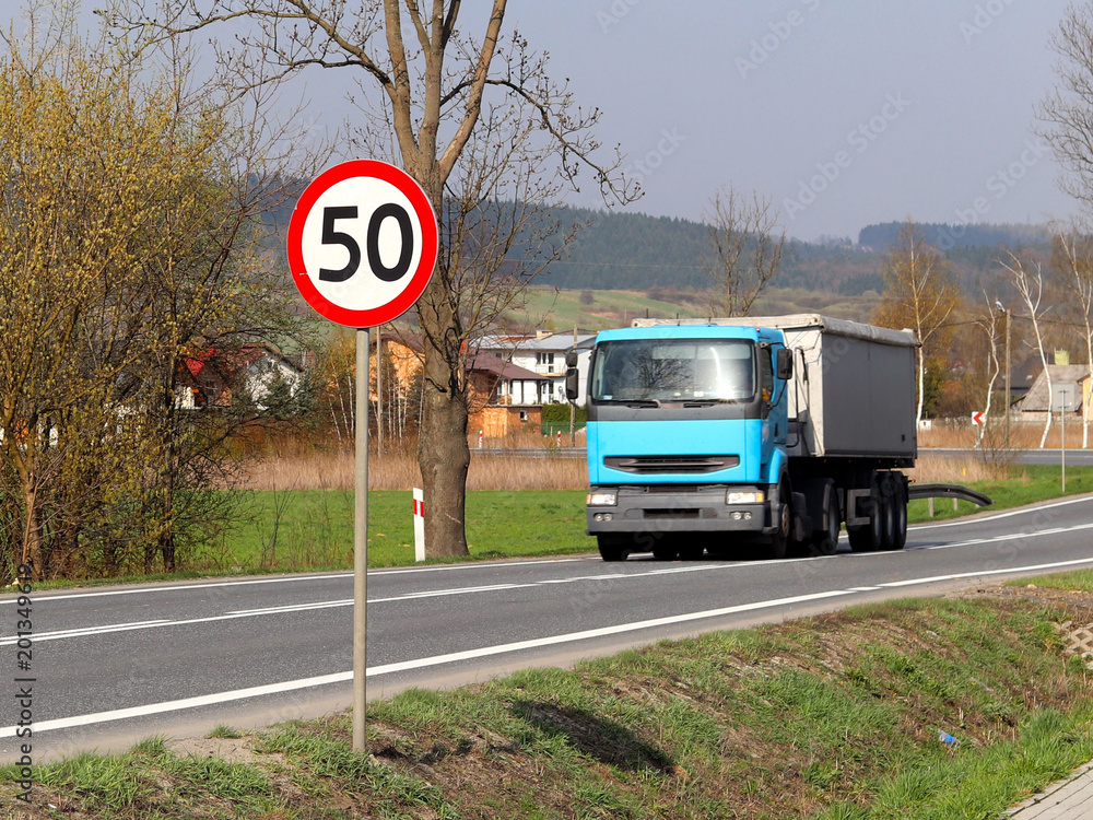 Foto de Stock Limiting the speed of traffic to 50 km/h. Road sign on ...