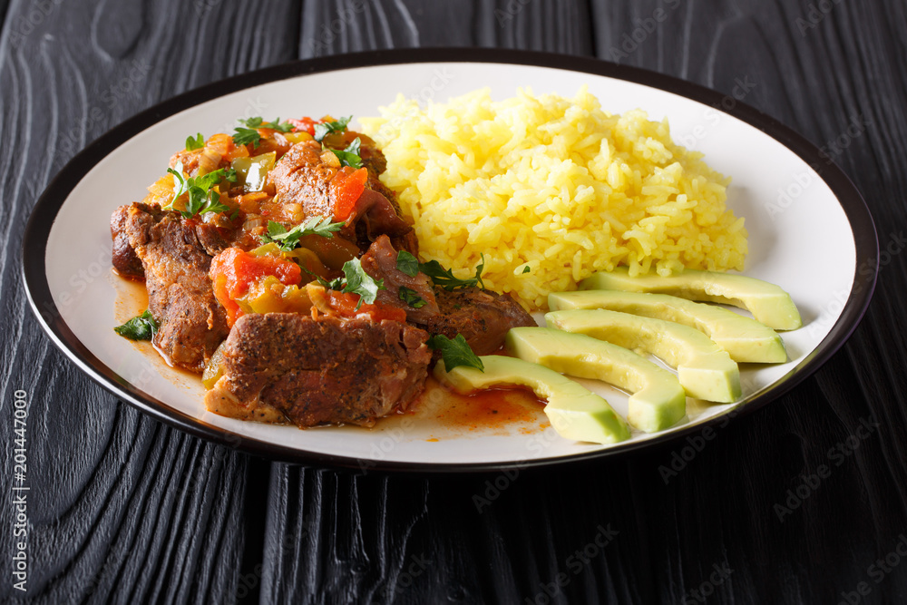 Ecuadorian traditional food: seco de chivo goat meat with a garnish of ...