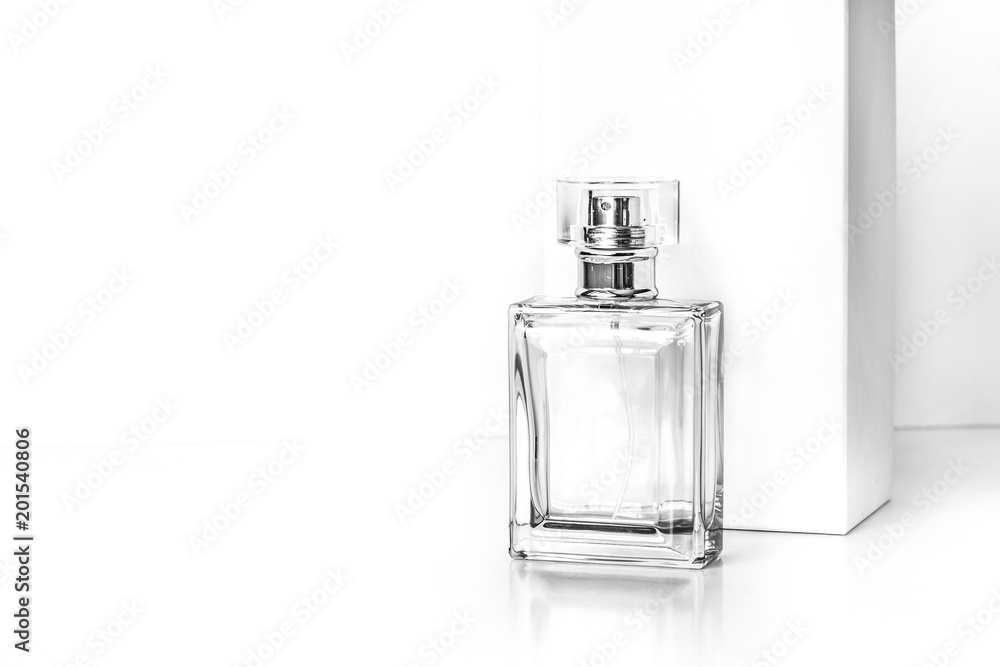 Perfume bottle in front of white box Stock Photo | Adobe Stock