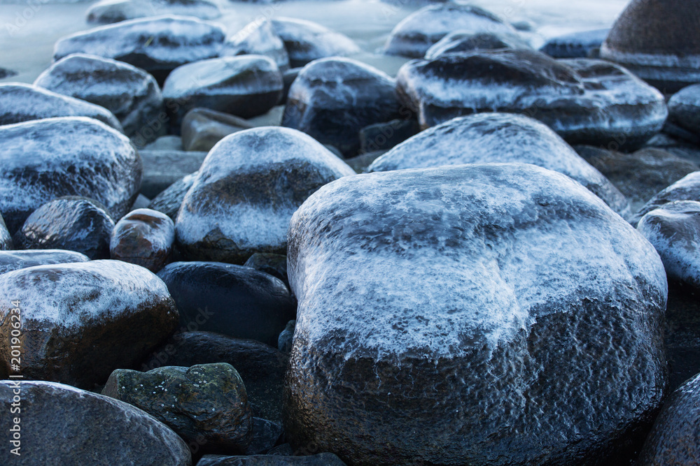 Ice on rocks in a beatch of Lofoten Island, Norway Stock Photo | Adobe ...