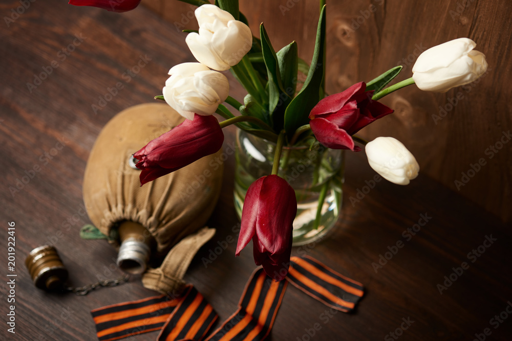 old soldier's flask and St. George's ribbon on wooden background, world ...