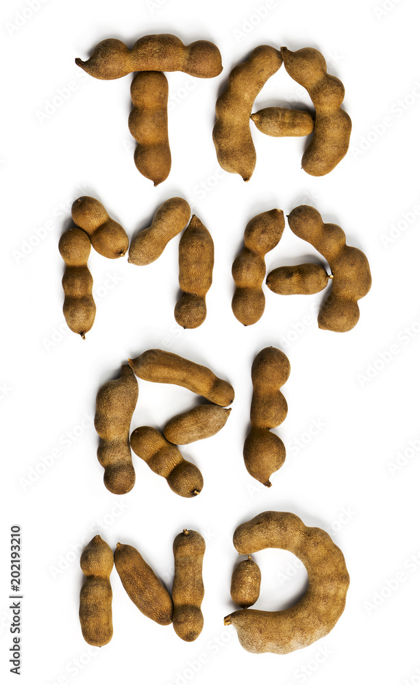 Word tamarind made of tamarind fruits. Top view Stock Photo | Adobe Stock