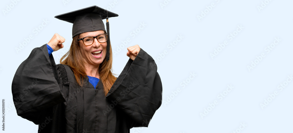 Senior graduate student woman happy and excited celebrating victory ...